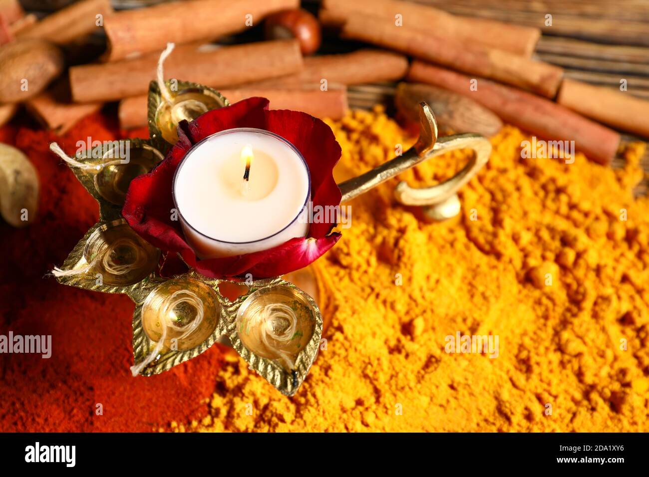 Diya lamp with spices for celebration of Divaly on table Stock Photo ...