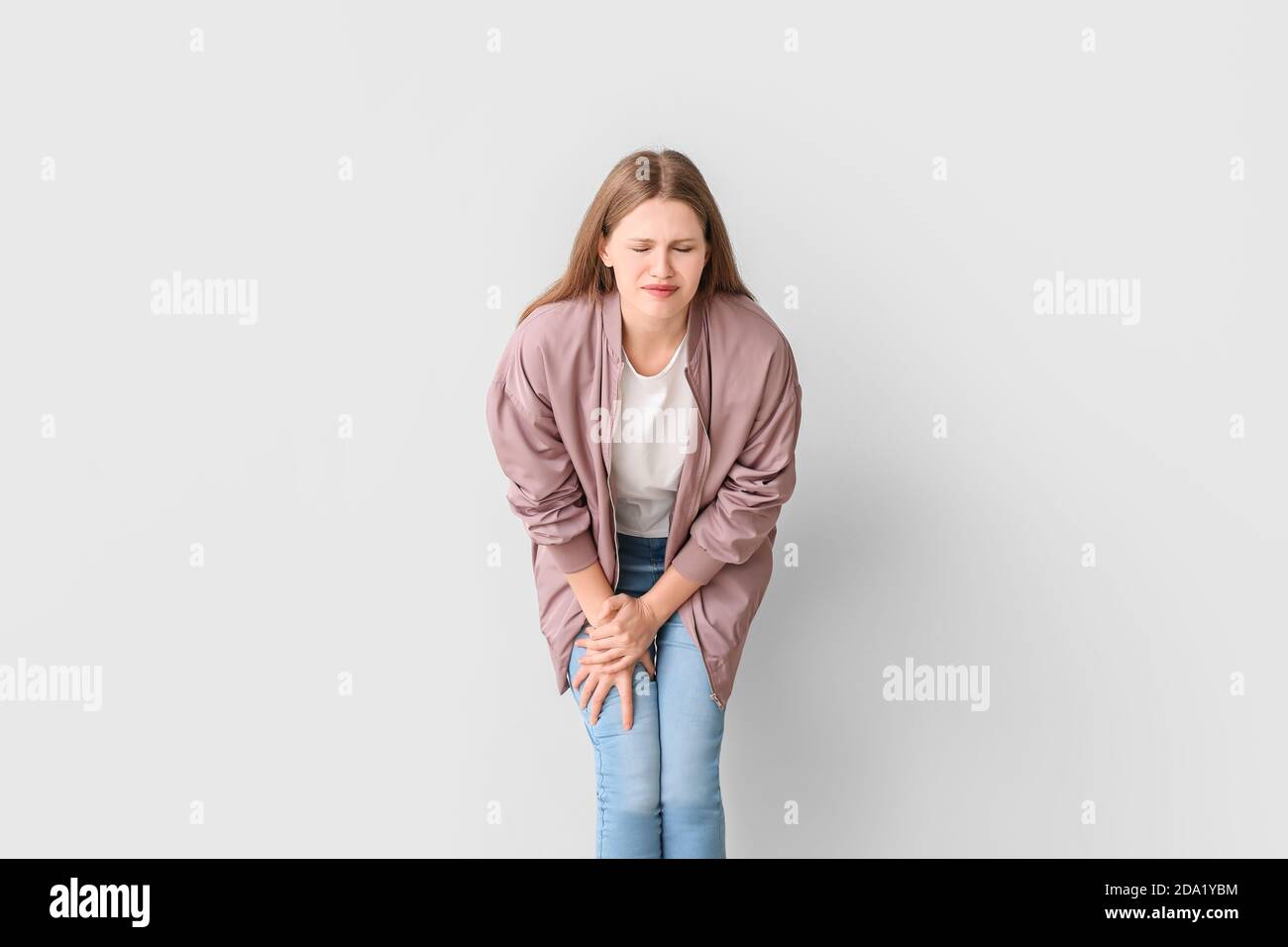 Woman with problem of limbs numbness on light background. Diabetes ...