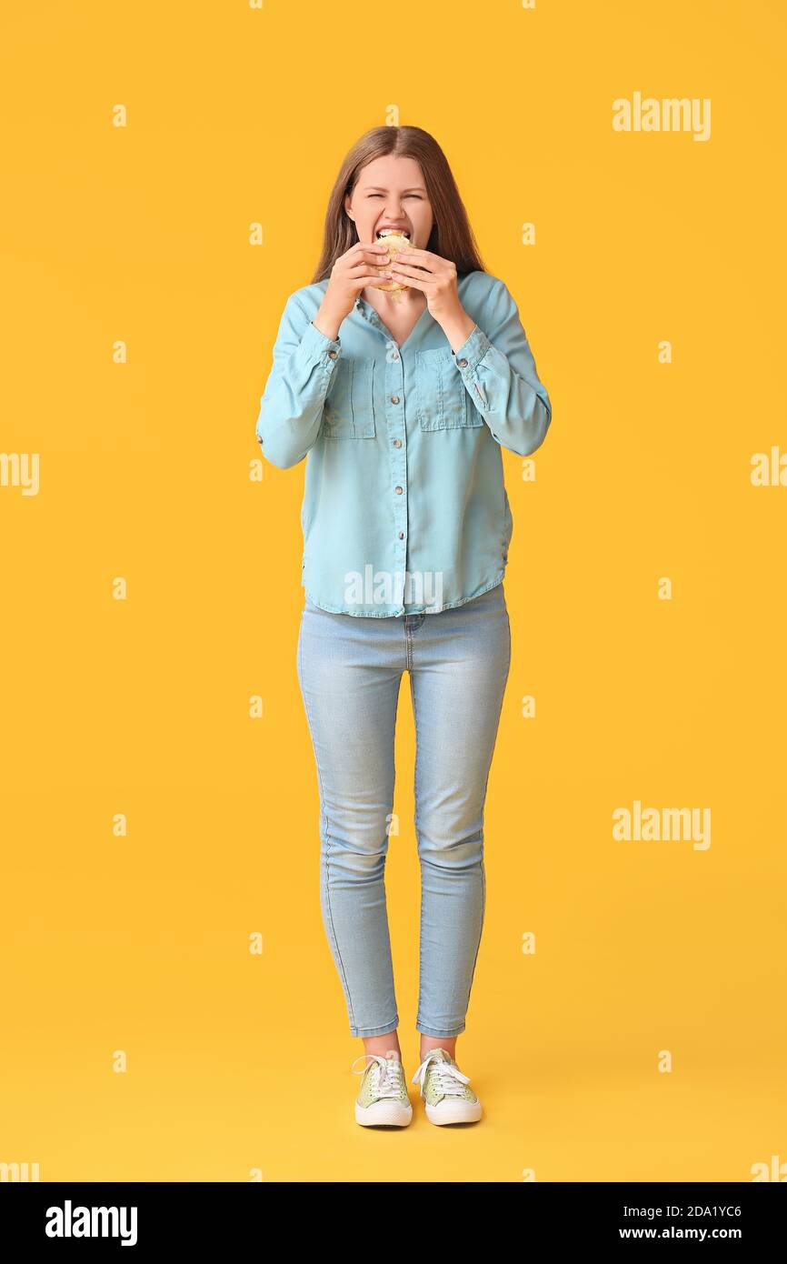 Woman with problem of strong hunger on color background. Diabetes ...