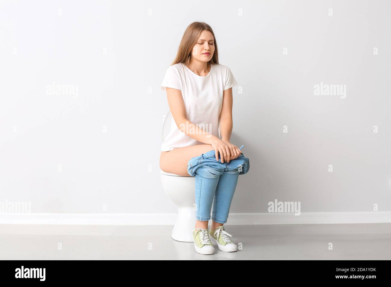 Woman With Problem Of Frequent Urination In Restroom Diabetes Symptoms