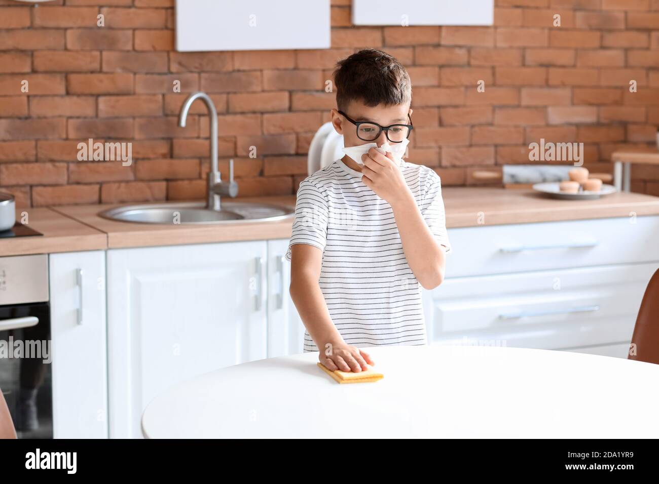 Boy cleaning table hi-res stock photography and images - Alamy