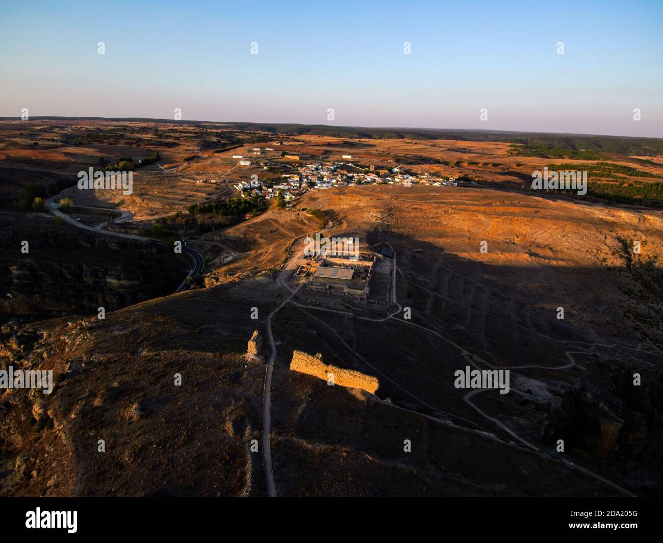 Aerial view of a small town on a vast landscape on a clear sky ...