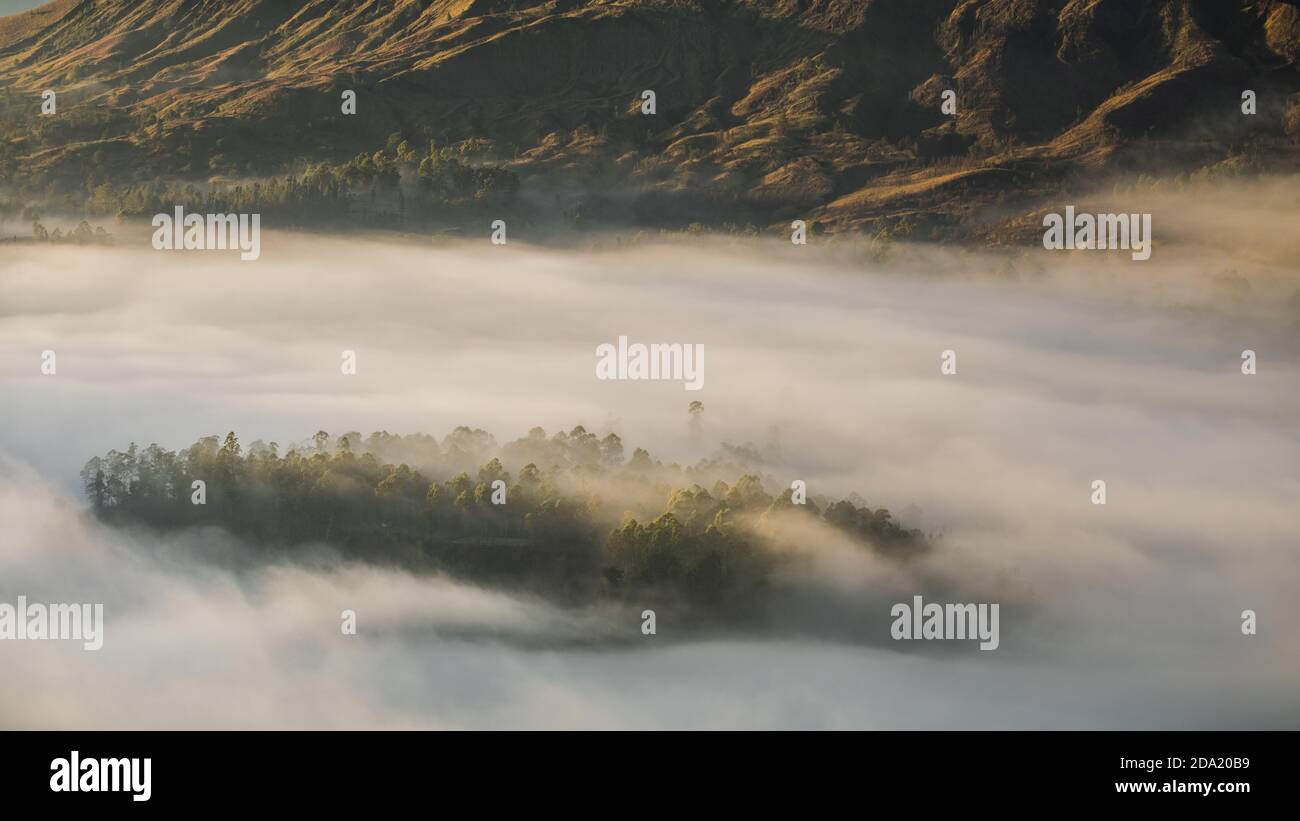 Minimalist layered mountain landscape with fog and low clouds. Nature ...