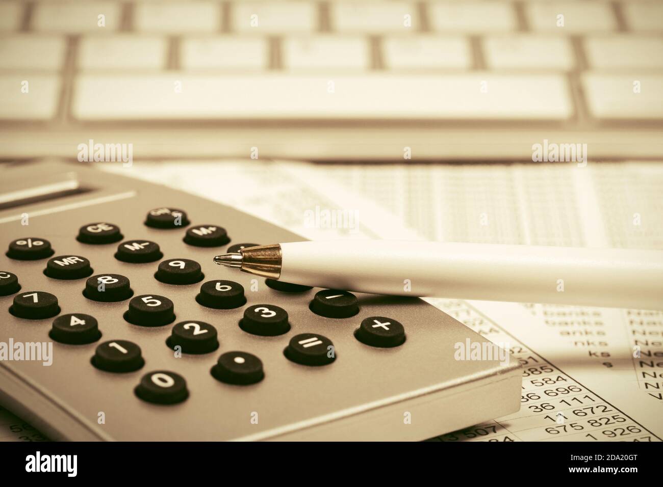 Financial accounting Pen and calculator on balance sheets Stock Photo ...