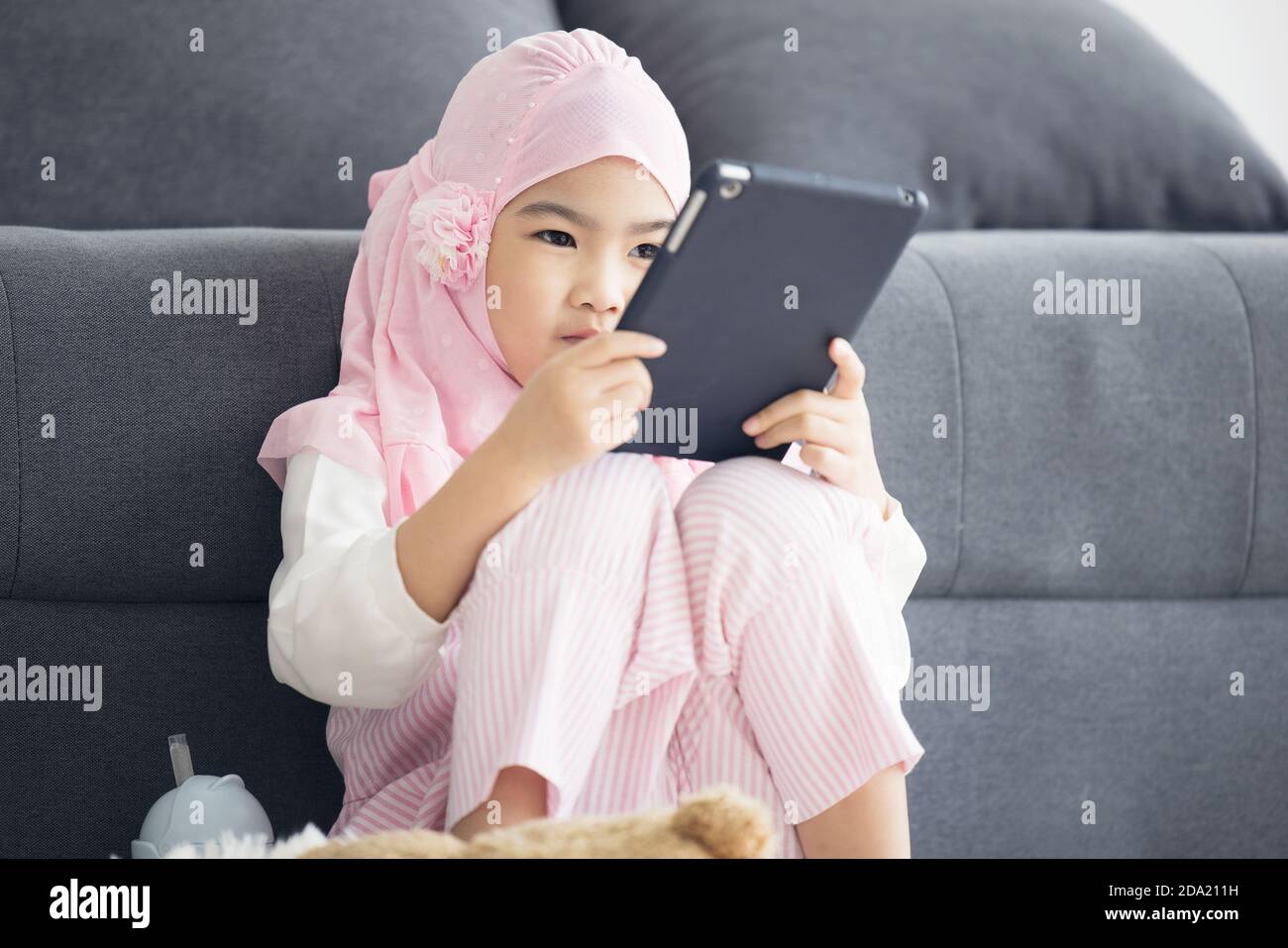Muslim teen girl computer hi-res stock photography and images - Alamy