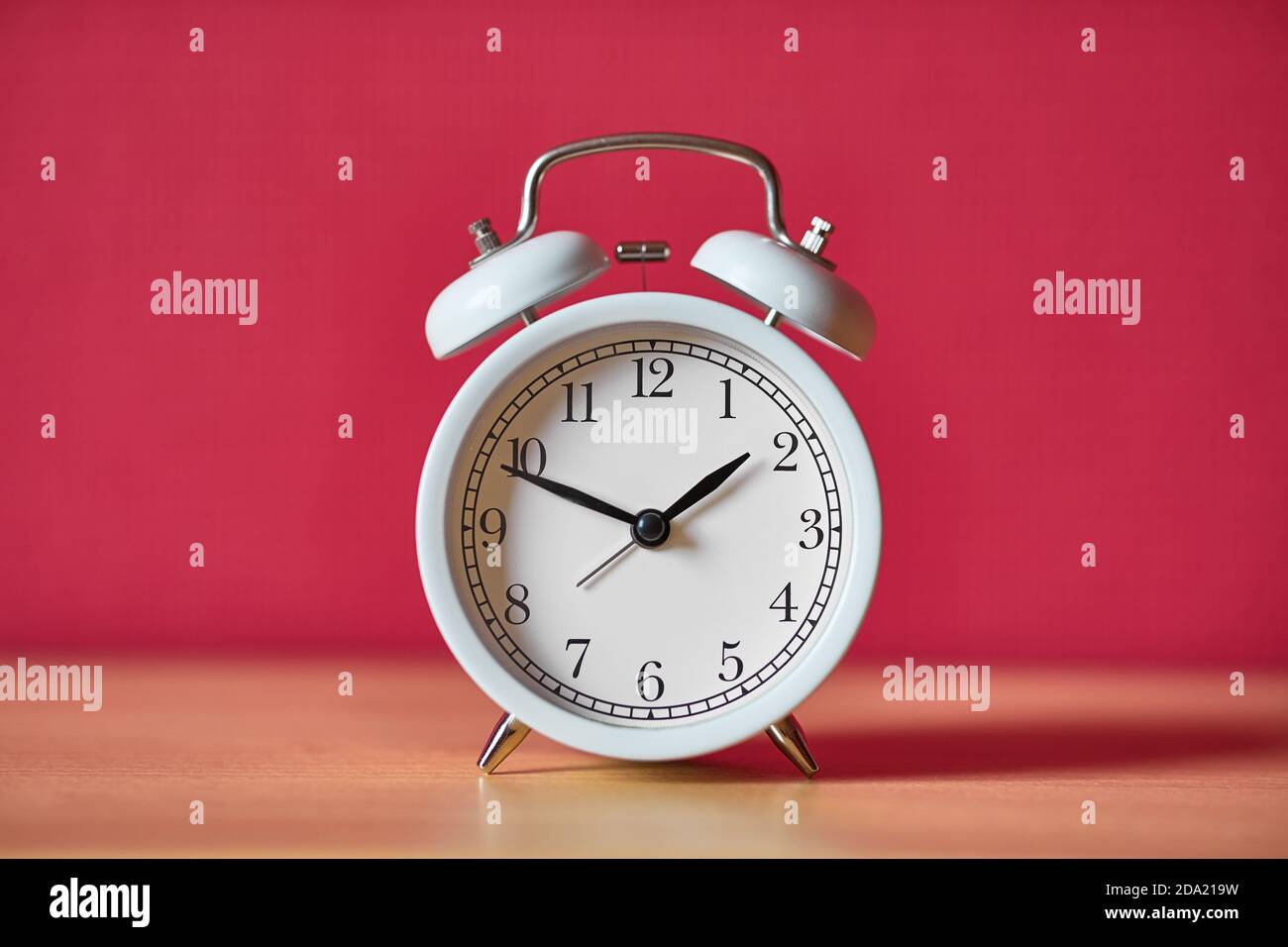 Simple clock on red hi-res stock photography and images - Alamy