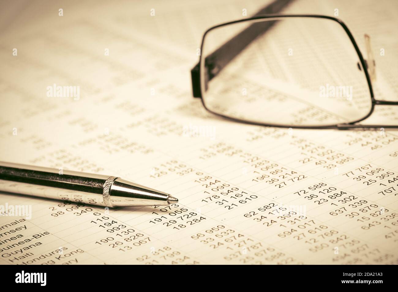 Financial accounting Pen and eyeglasses on balance sheets Stock Photo ...