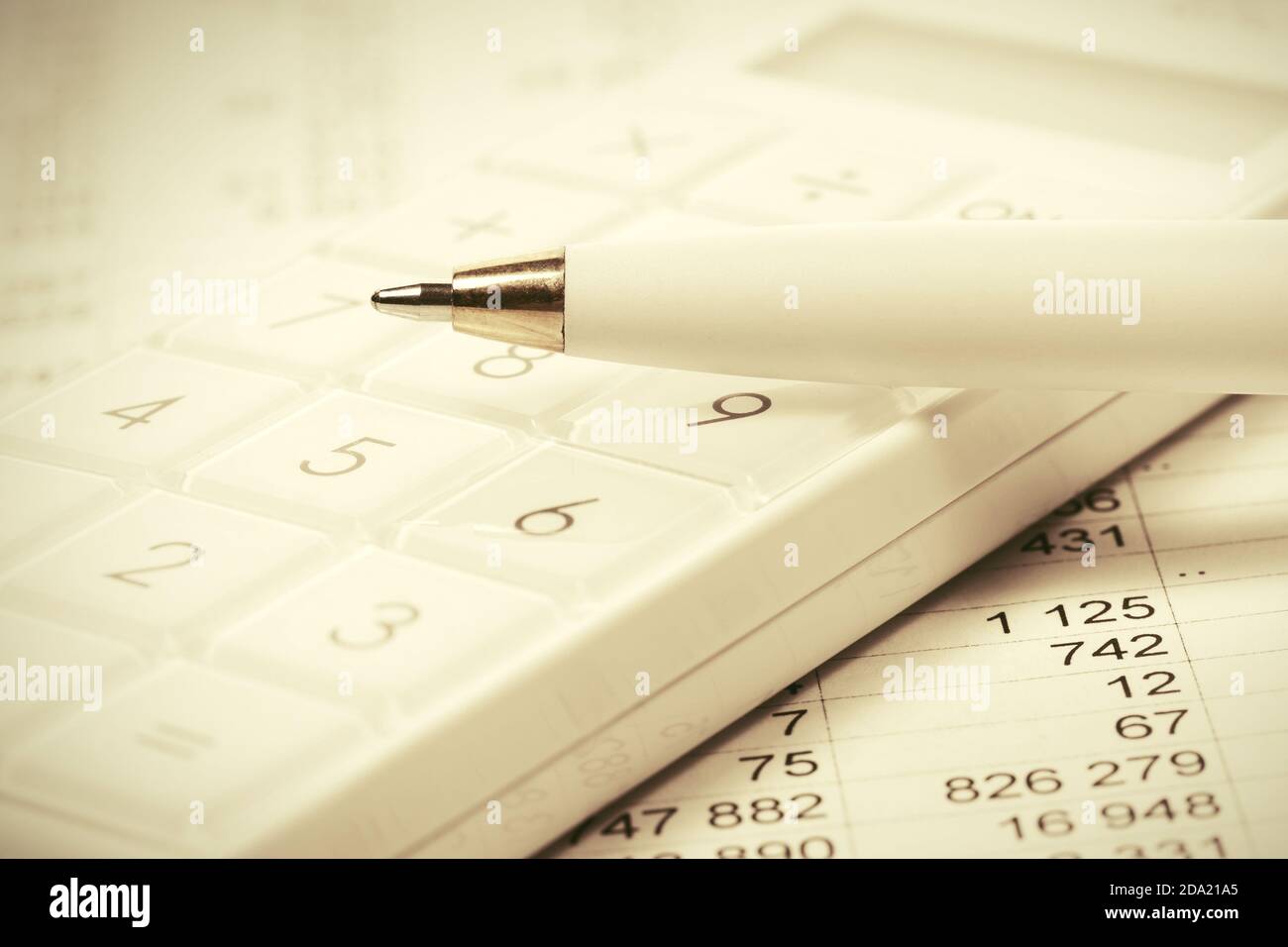 Financial accounting Pen and calculator on balance sheets Stock Photo ...