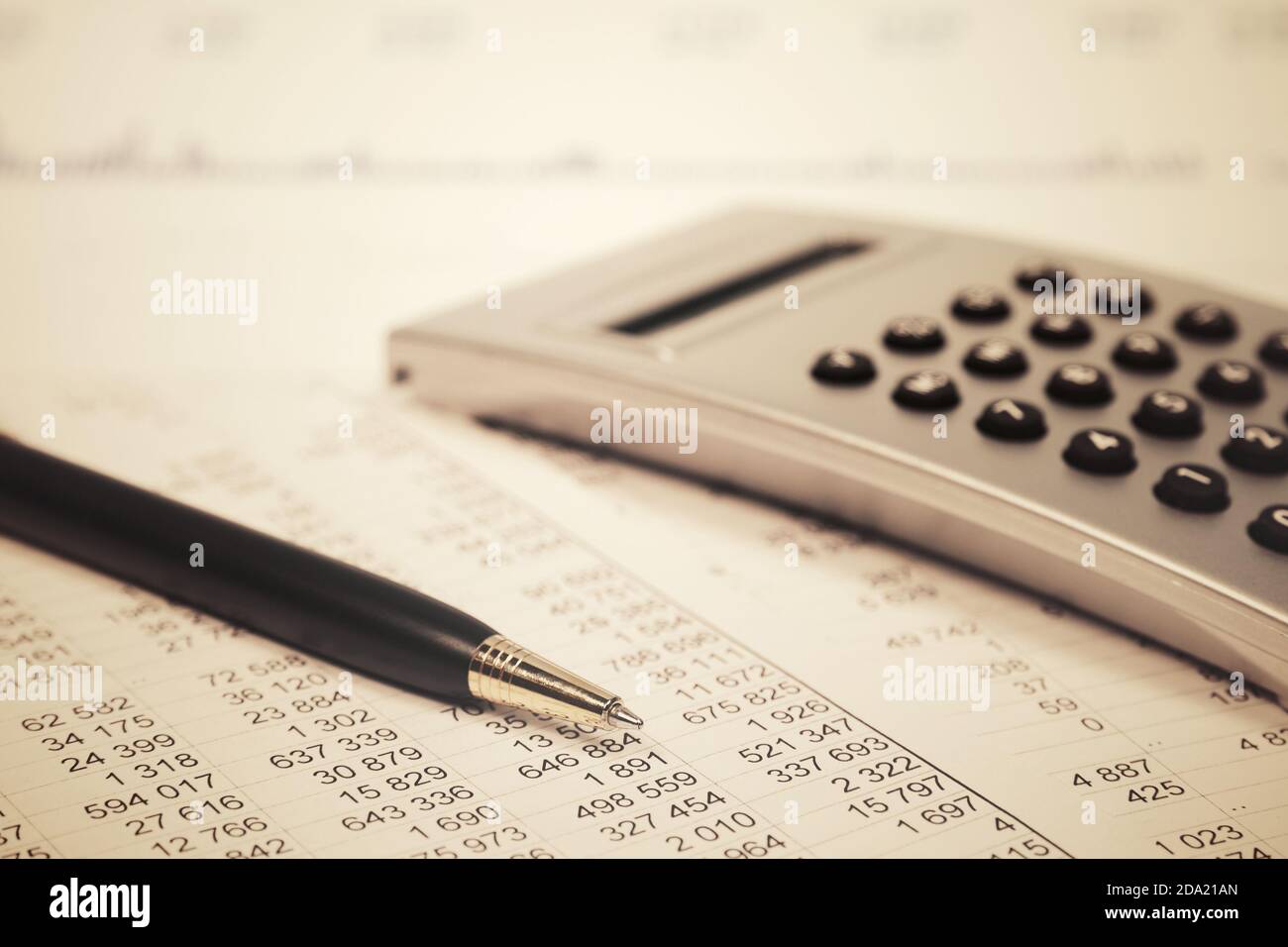 Financial accounting Pen and calculator on balance sheets Stock Photo ...