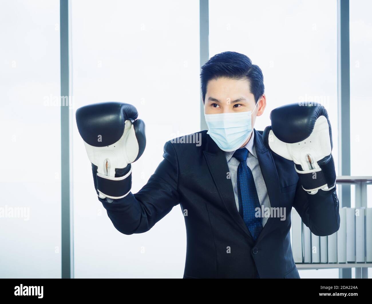 Asian Businessman wearing suit and protective face mask and hand ...