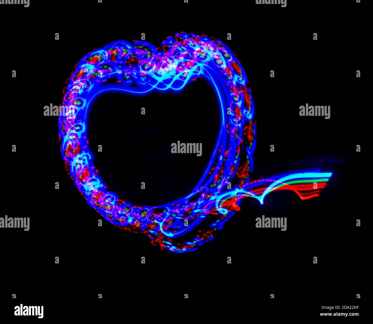 Light painting. Heart shape created by different light sources. Black ...