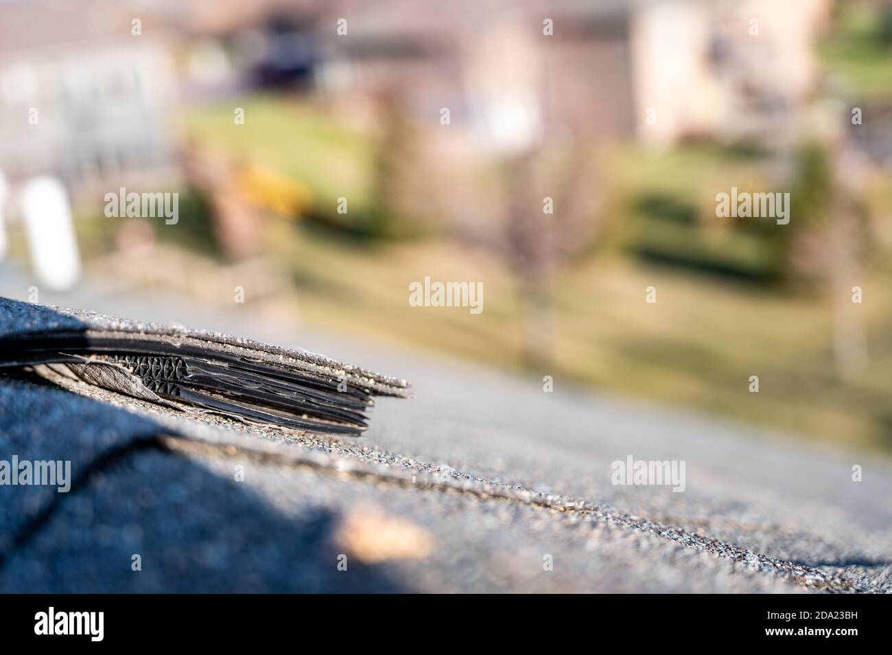 Typical residentail ridge cap on a shingle roof apex Stock Photo - Alamy
