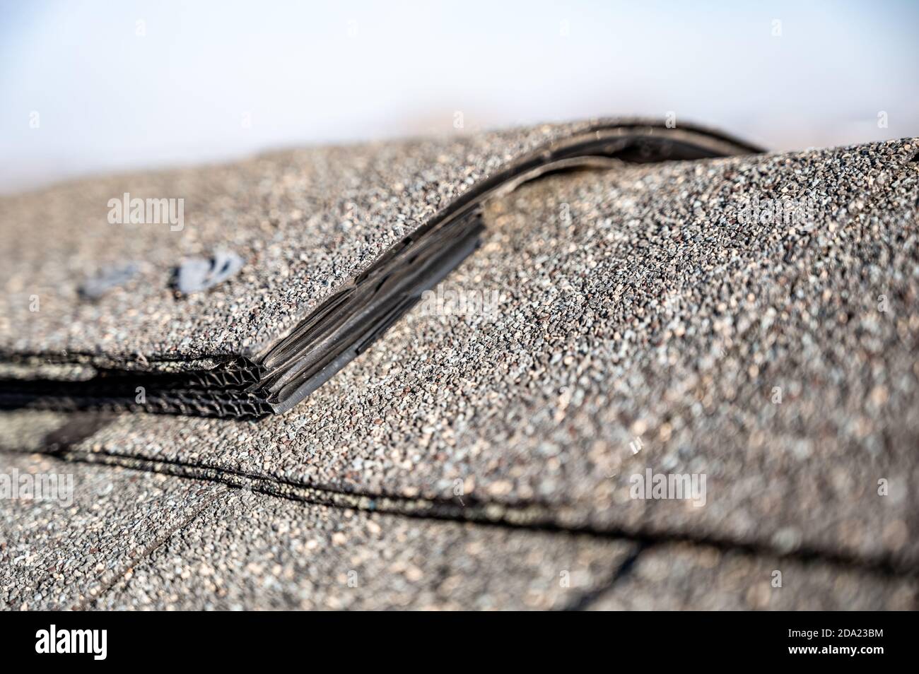 Typical residentail ridge cap on a shingle roof apex Stock Photo - Alamy