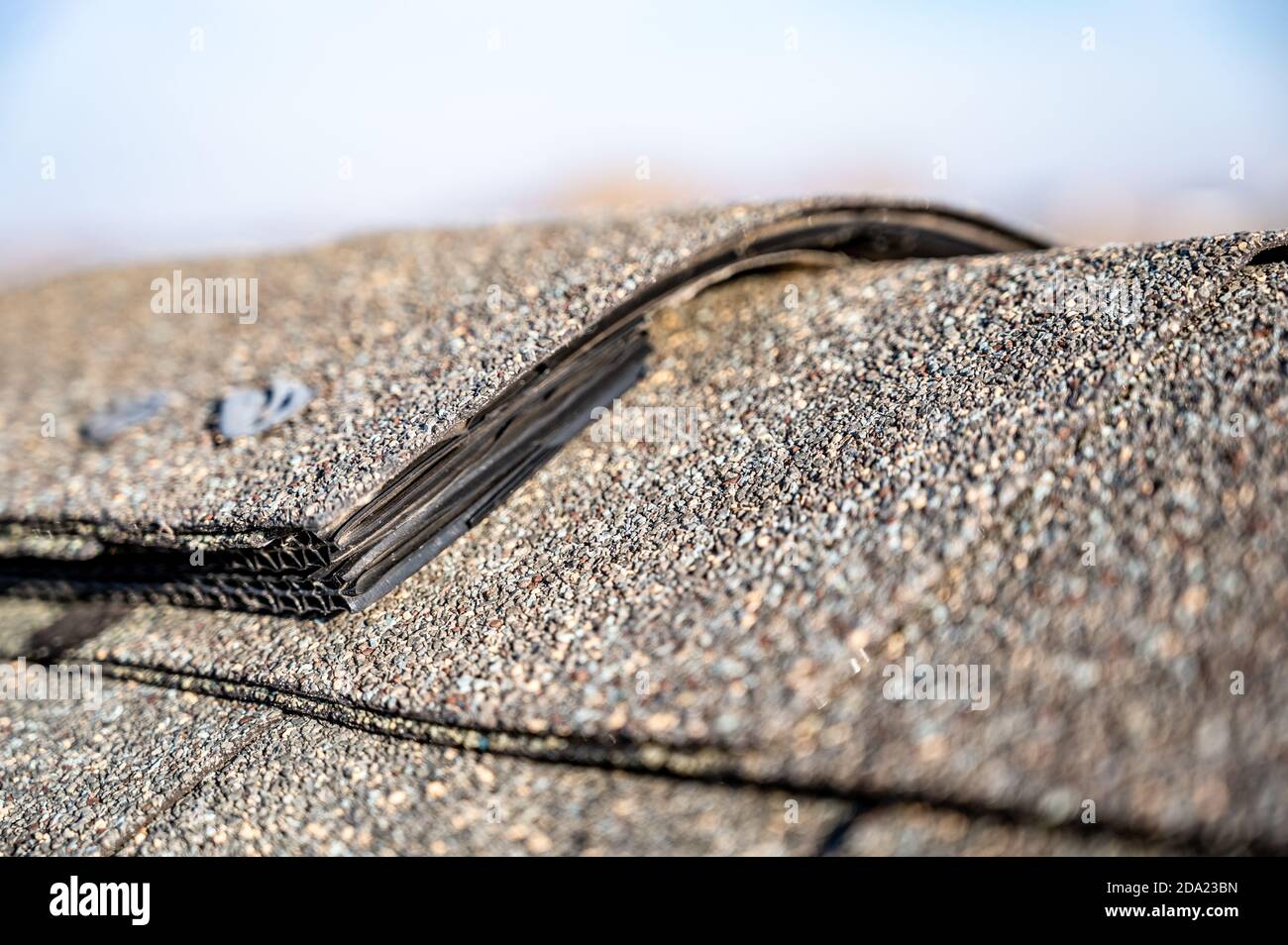Typical residentail ridge cap on a shingle roof apex Stock Photo - Alamy