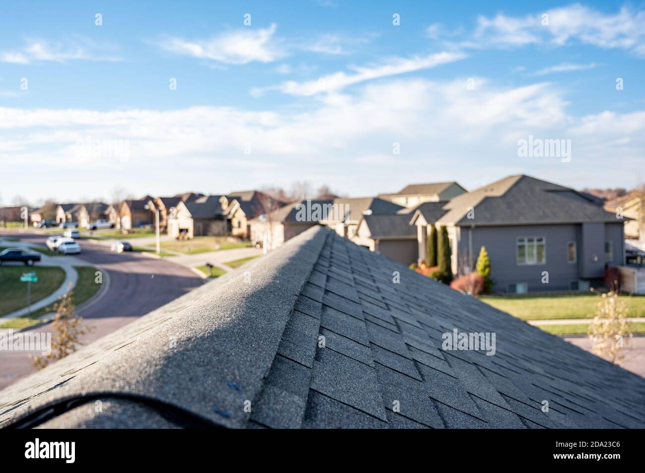 Typical residentail ridge cap on a shingle roof apex Stock Photo - Alamy