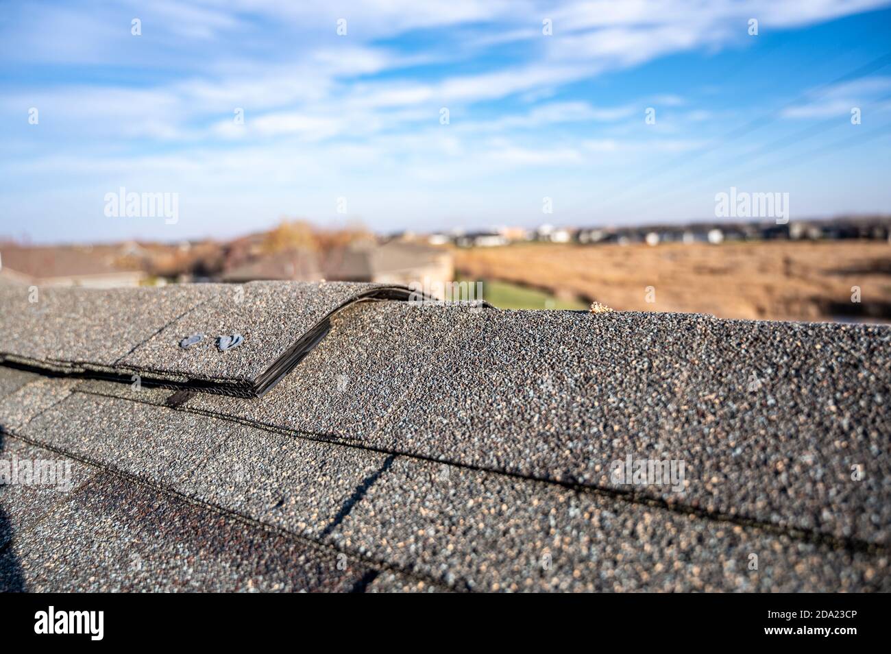 Typical residentail ridge cap on a shingle roof apex Stock Photo - Alamy