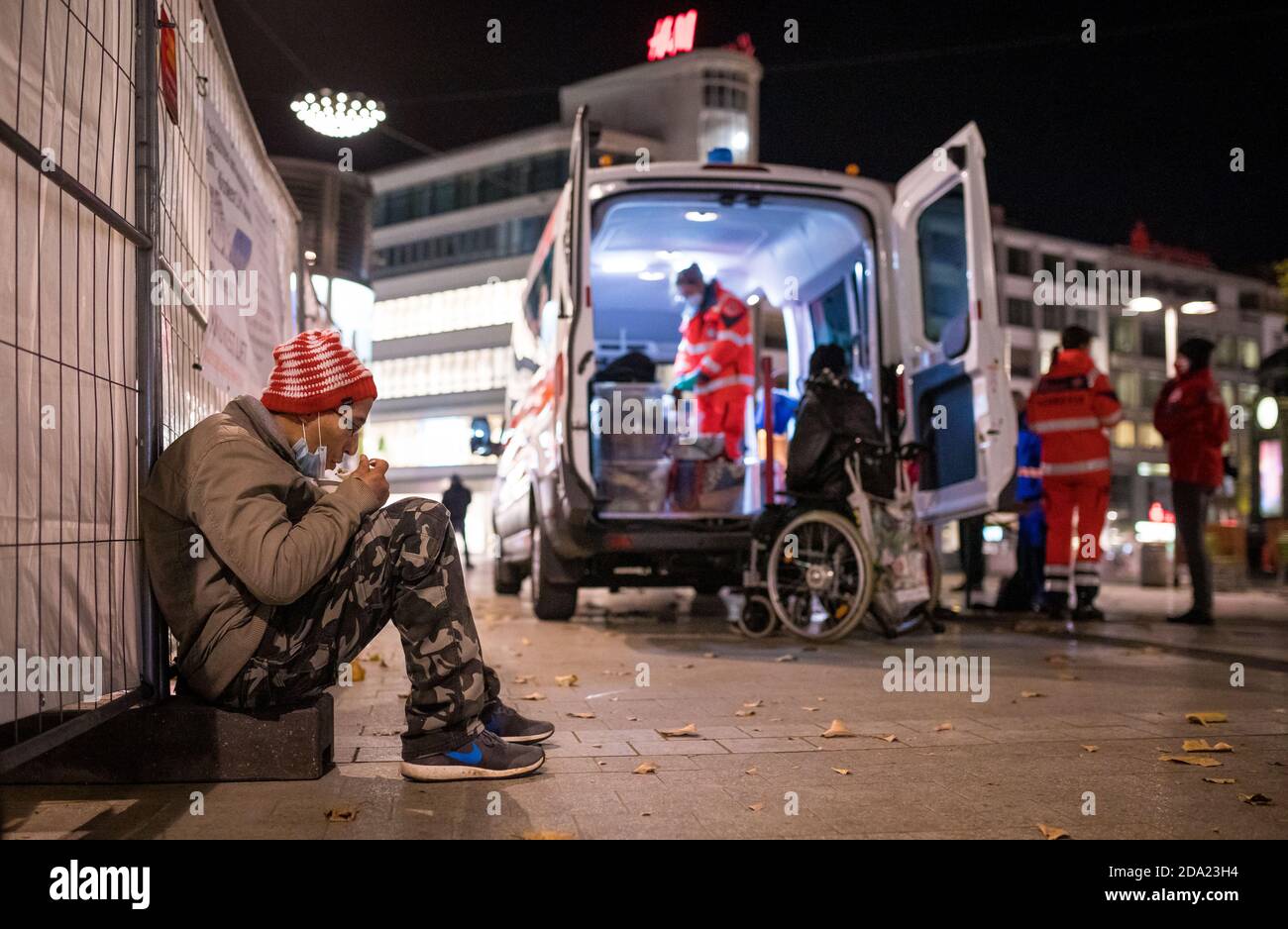 Hanover, Germany. 04th Nov, 2020. A homeless man sits in the city ...