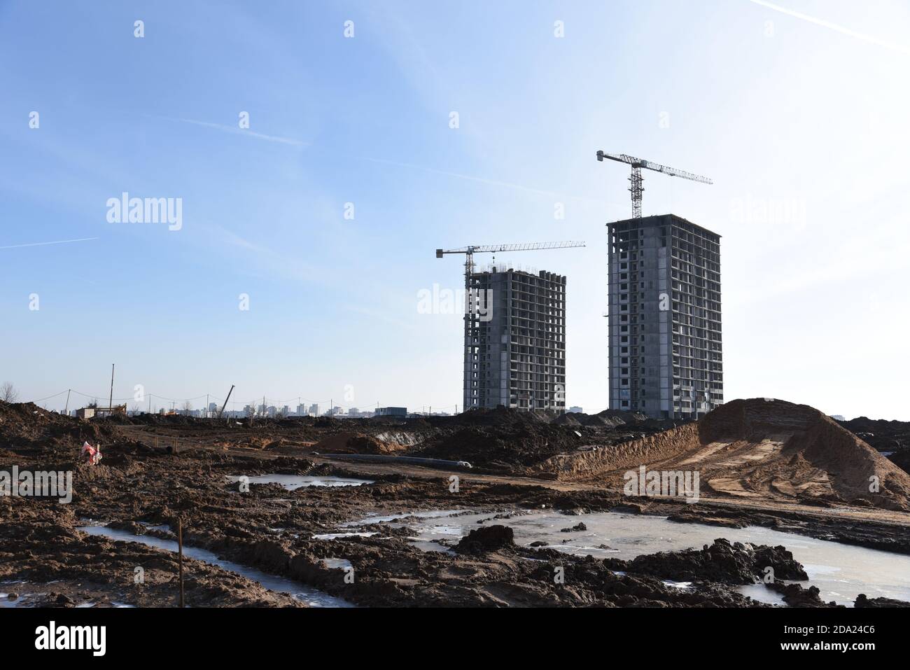 Tower cranes constructing a new residential build. Laying or ...