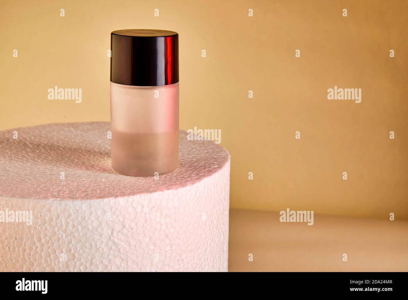 Harvesting perfume bottles without labels on a white podium Stock Photo ...
