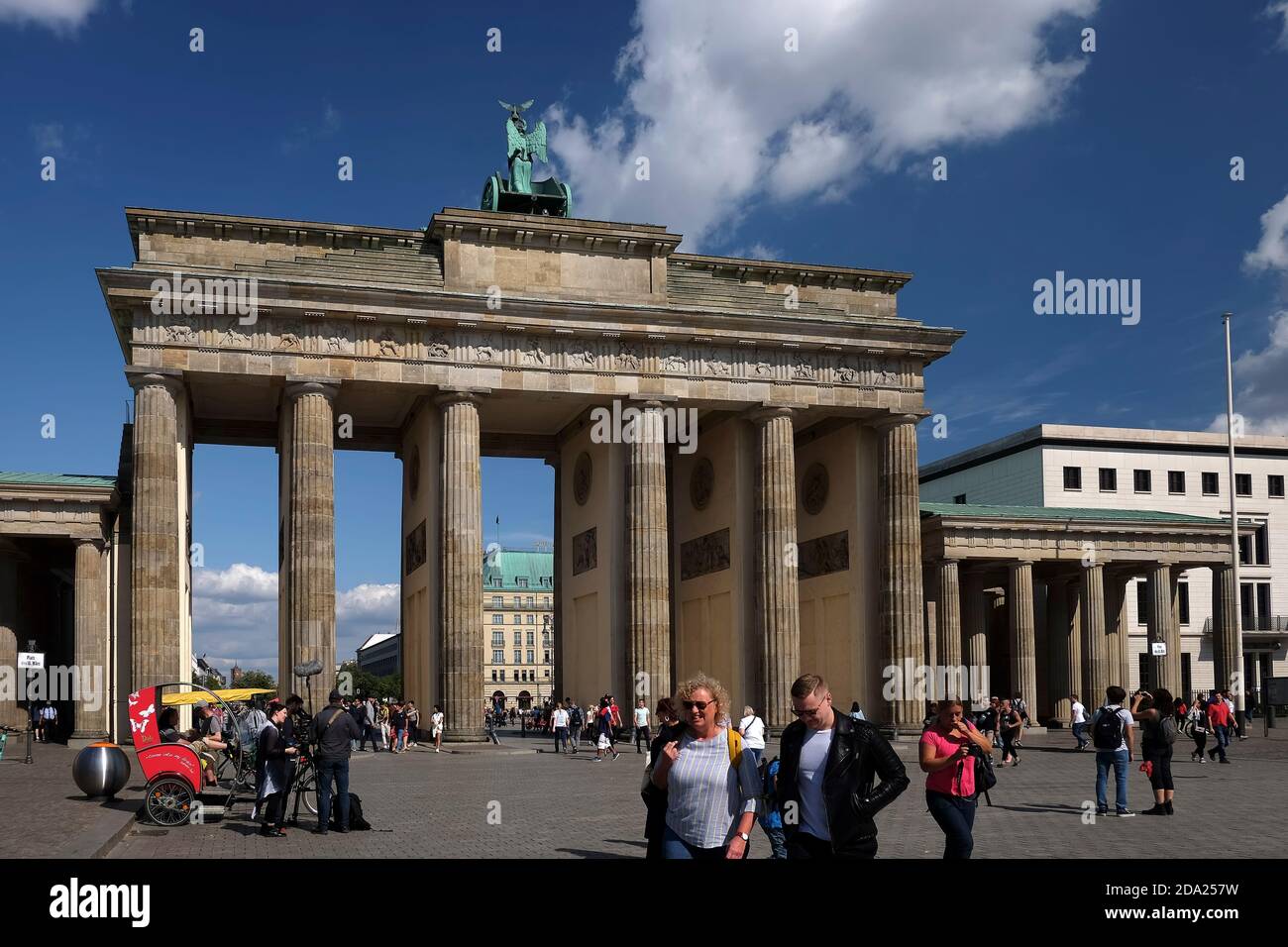 People walking near the Brandenburg gate. Constructed between 1788 and ...