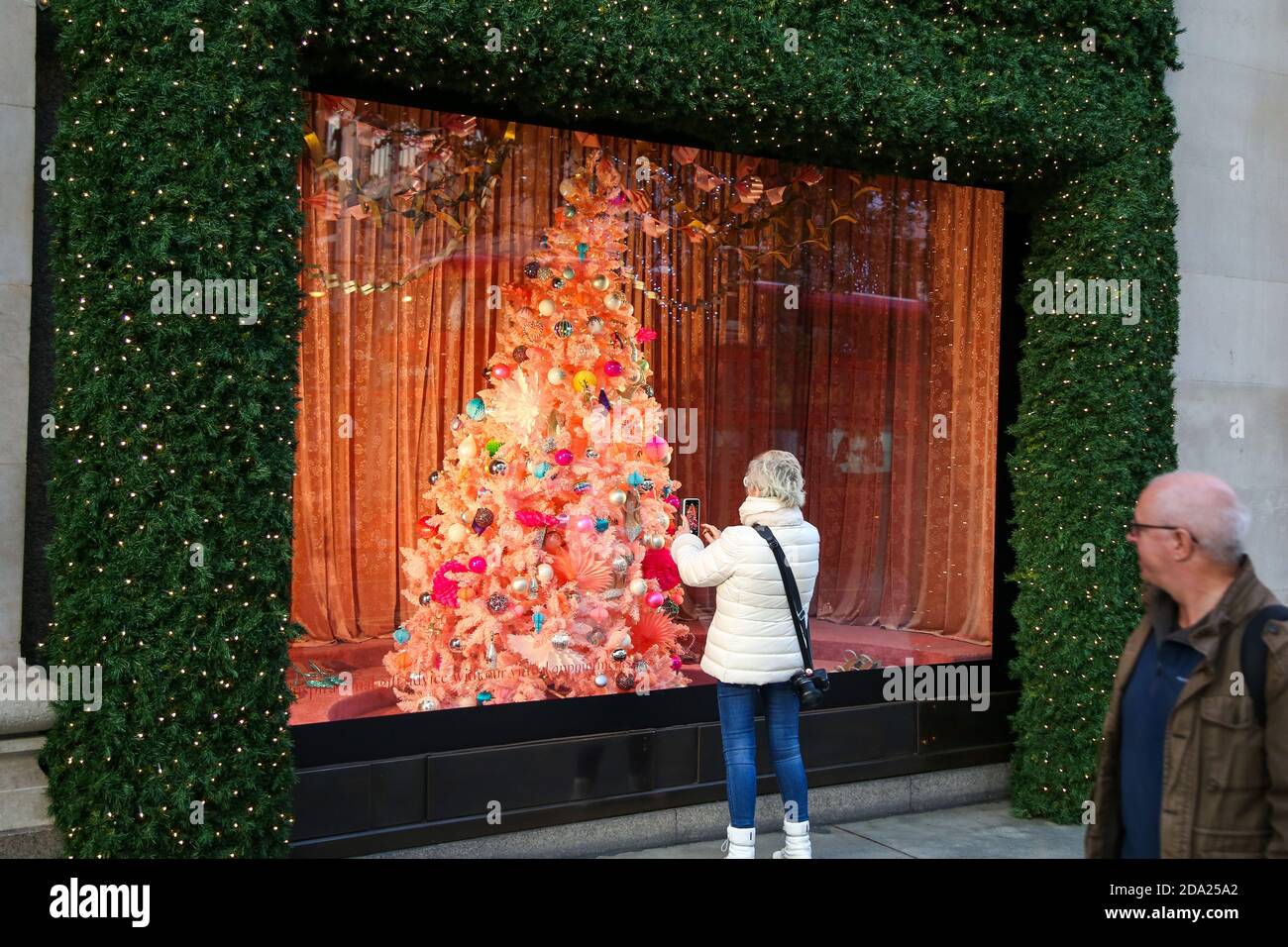 London, UK. 07th Nov, 2020. A woman takes a photo of Selfridges ...