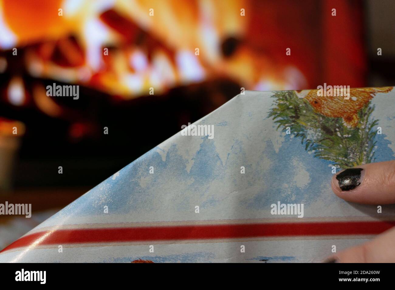 wrapping a christmas present Stock Photo - Alamy