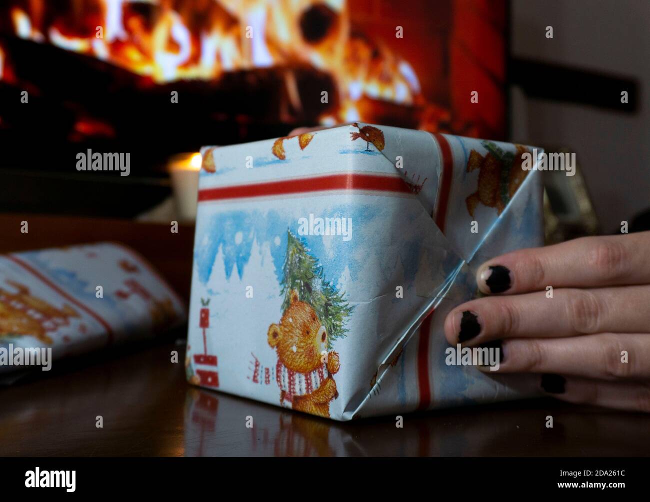 wrapping a christmas present Stock Photo - Alamy