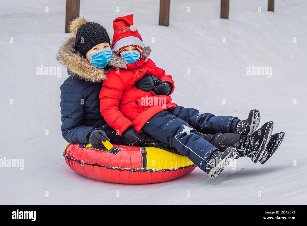 mom son wearing a medical mask during COVID-19 coronavirus ride on an ...
