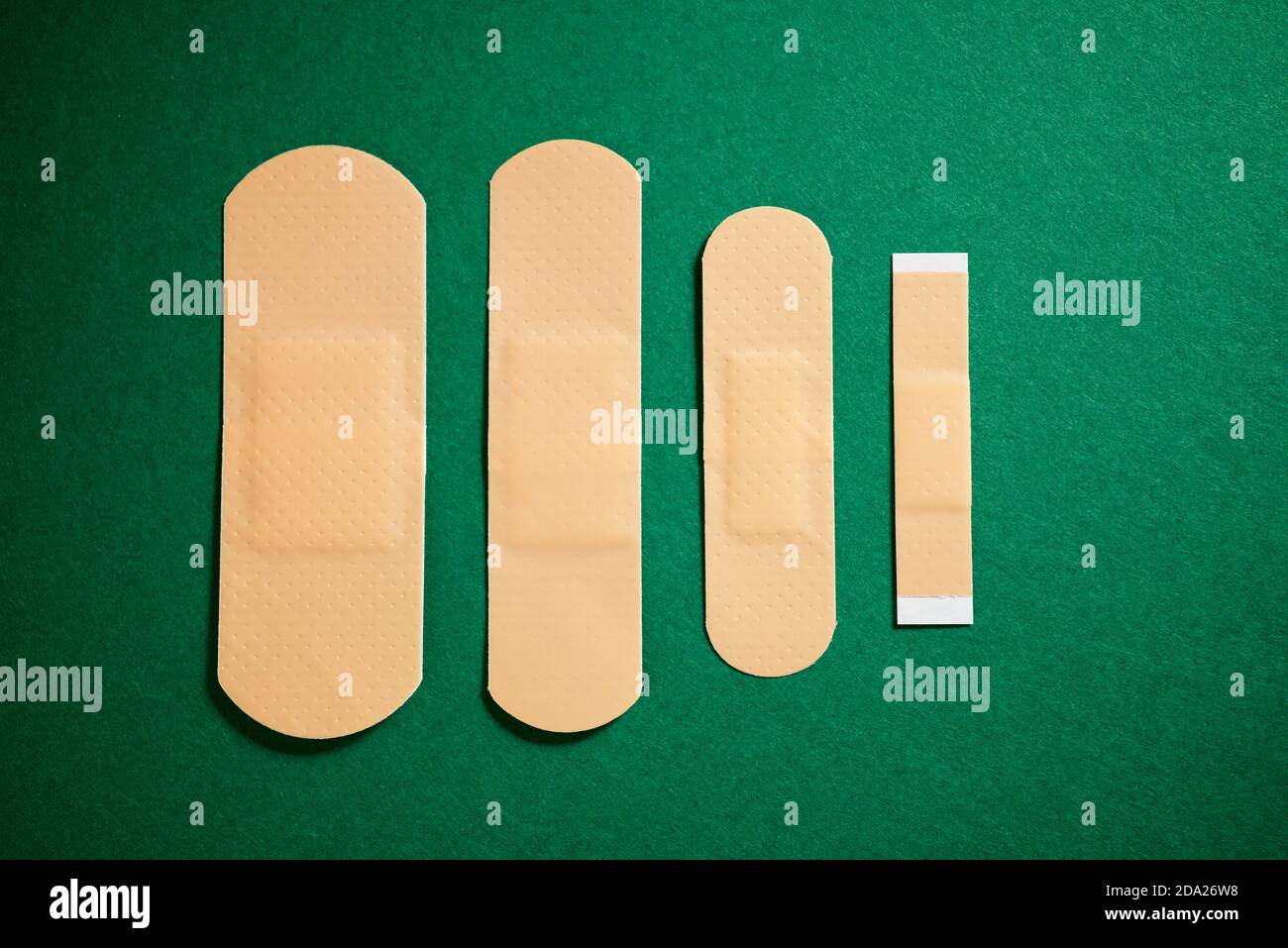 Green plasters hi-res stock photography and images - Alamy