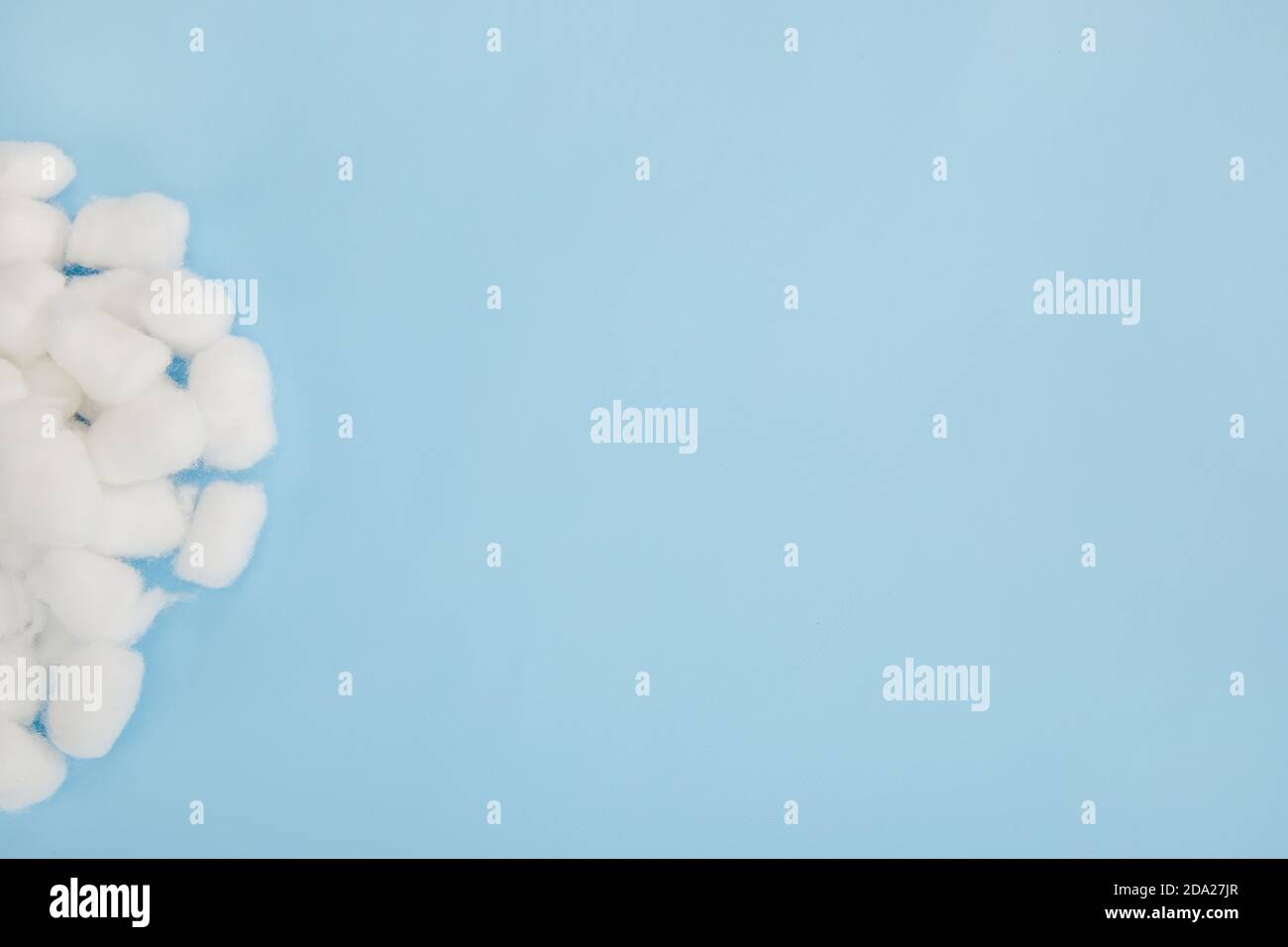 Top view of cotton balls isolated on light blue background Stock Photo ...