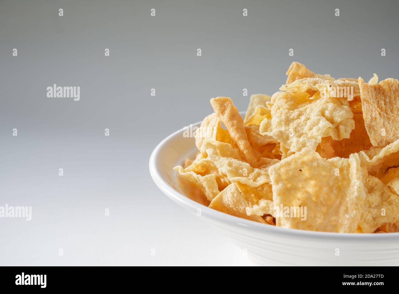 Closeup of a bowl of golden tempting fried yuba Stock Photo - Alamy