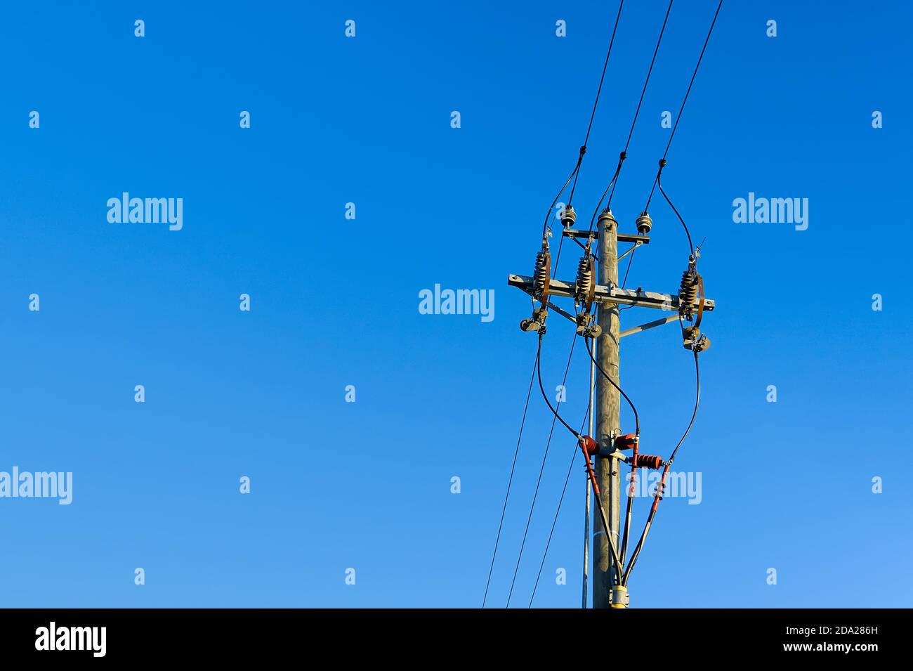 electric power sky lines and connections on a wooden post. wooden ...