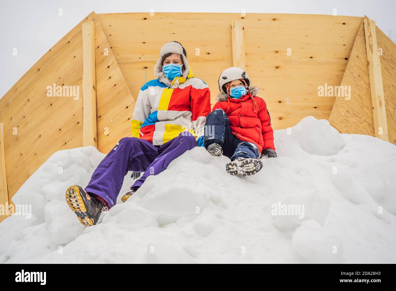 Dad and son wearing a medical mask during COVID-19 coronavirus on a ...