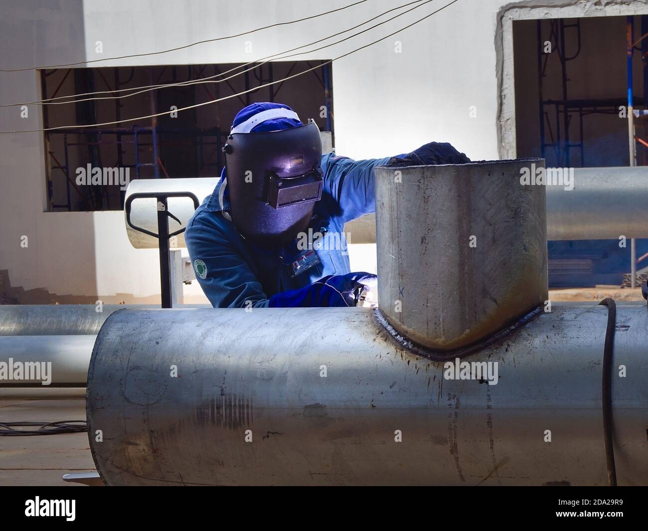 Worker welding a pipeline Stock Photo - Alamy