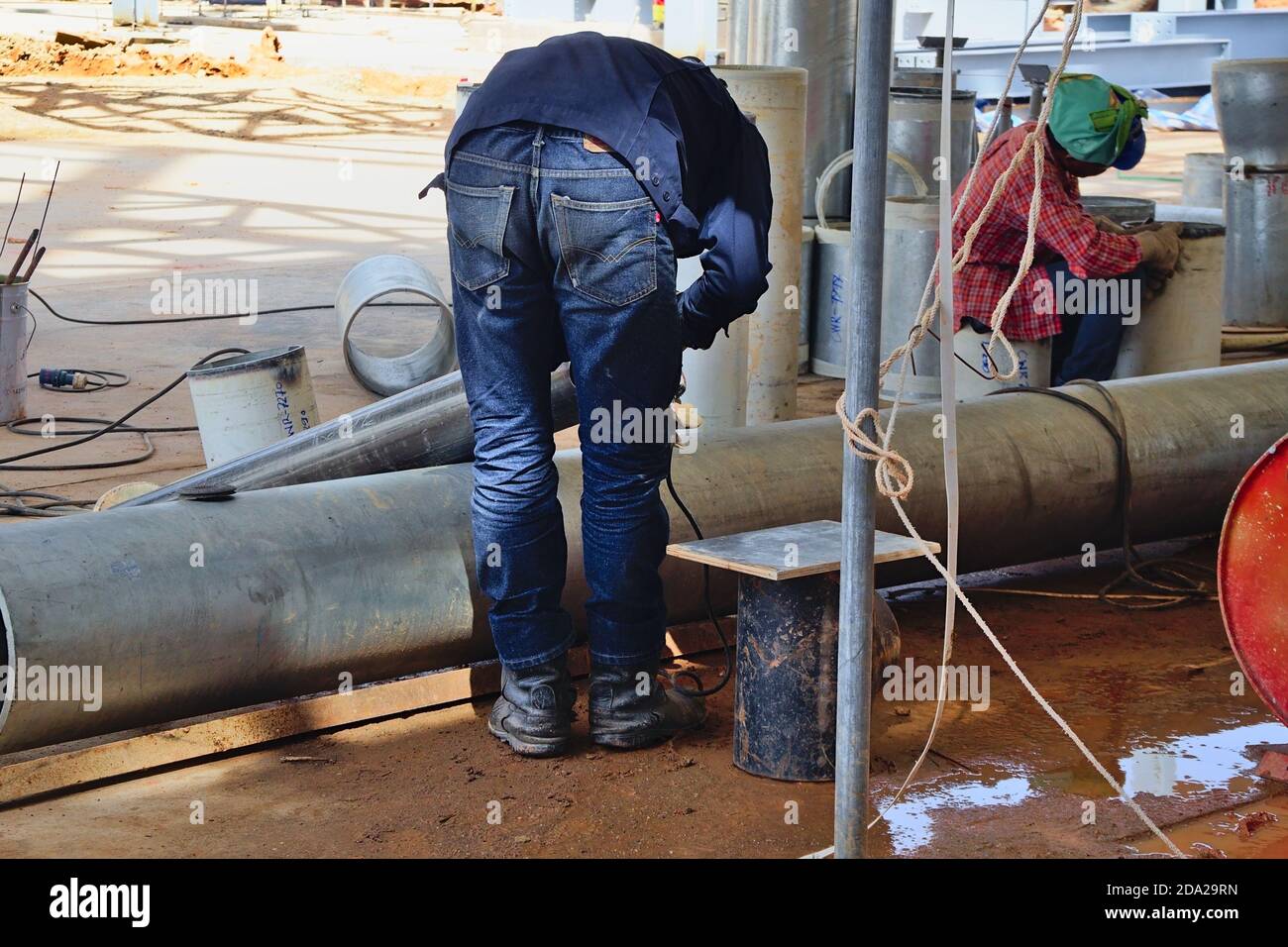 Worker welding a pipeline Stock Photo - Alamy