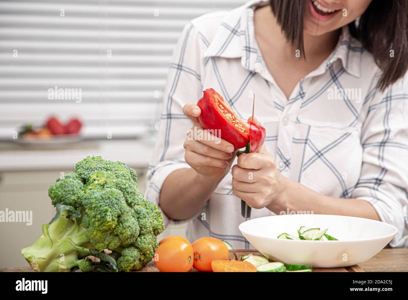 The process of preparing a vegetarian salad. Diet and healthy food ...