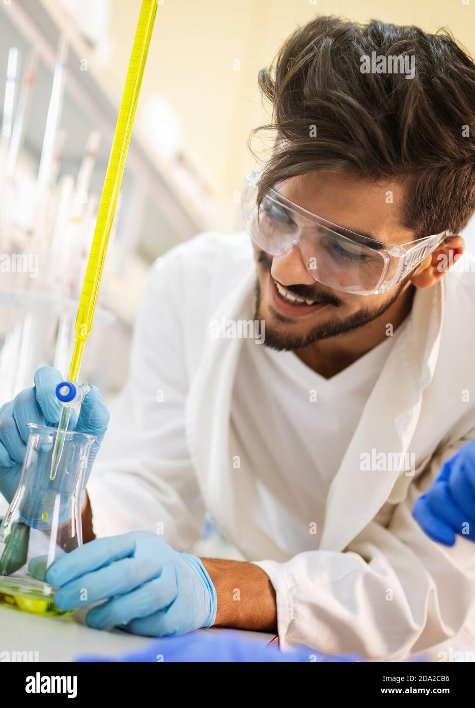 Young scientist student man working at the laboratory Stock Photo - Alamy