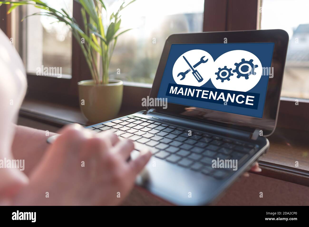 Laptop screen displaying a maintenance service concept Stock Photo - Alamy