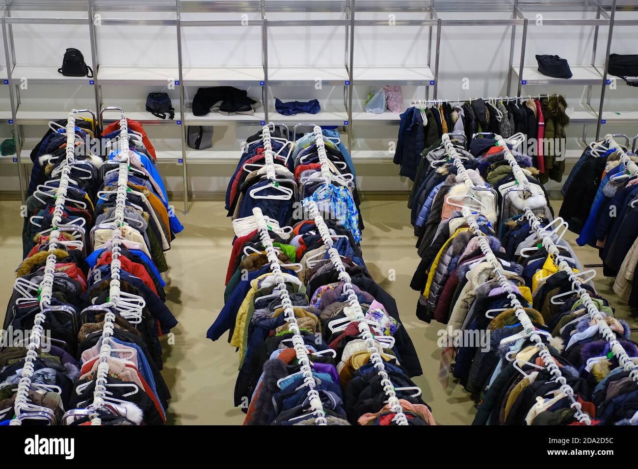 Large public locker room with clothes at an event Stock Photo - Alamy