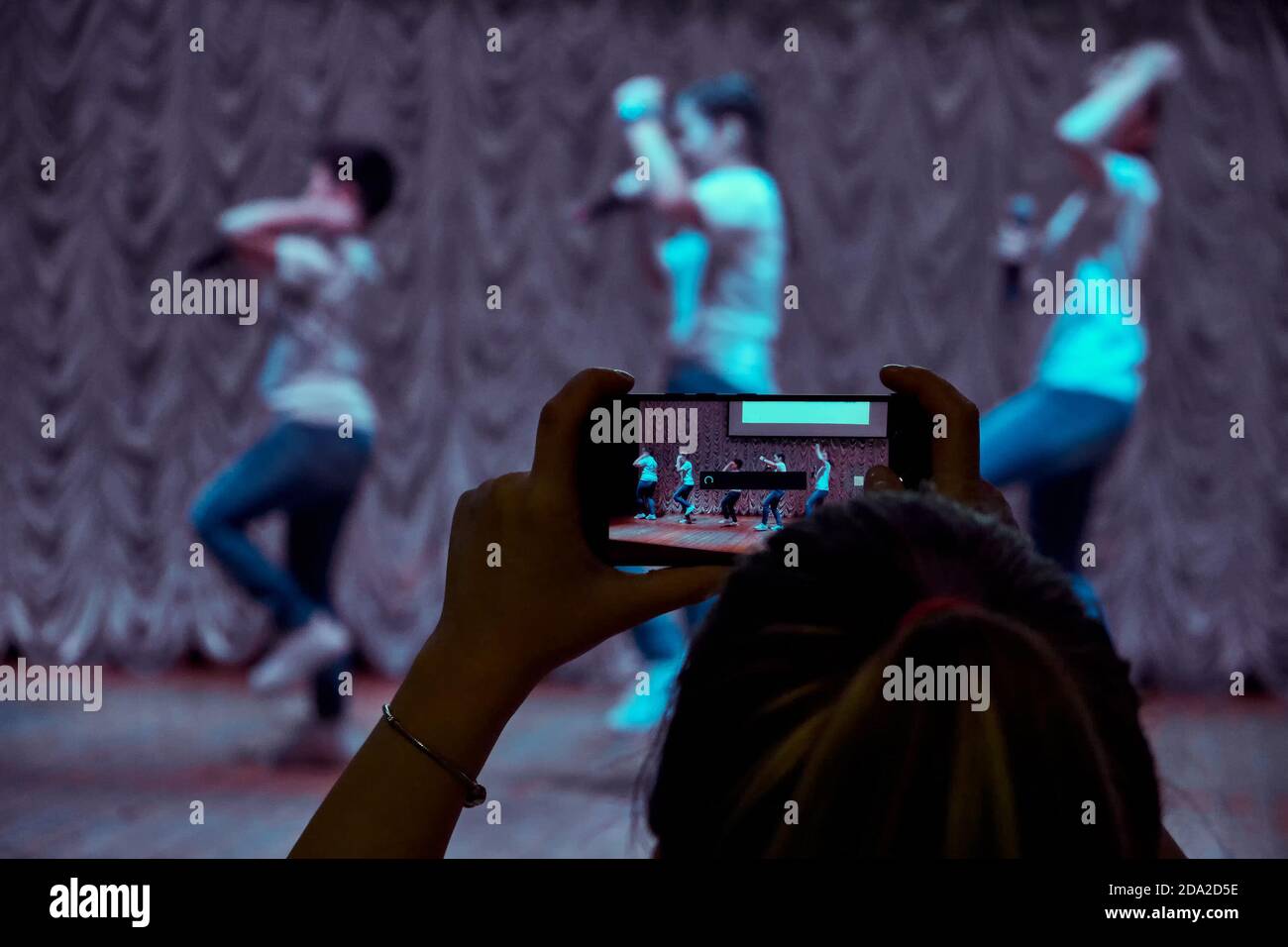 Pictures on the phone of the contestants vocal and choreography ...