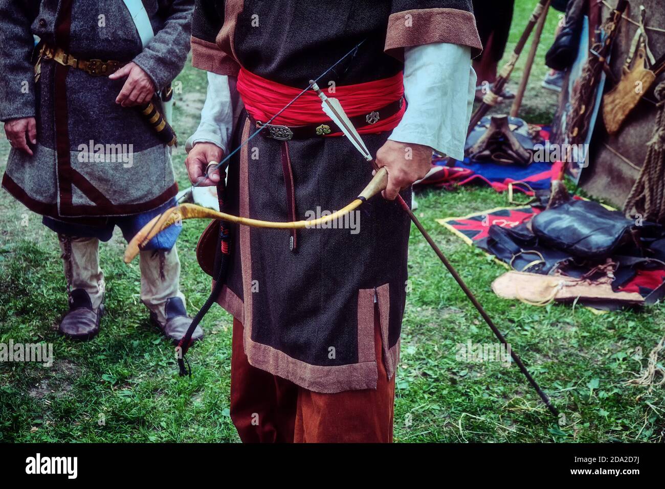 Archer retro tribe stands with a bow in his hand. Reconstruction old ...
