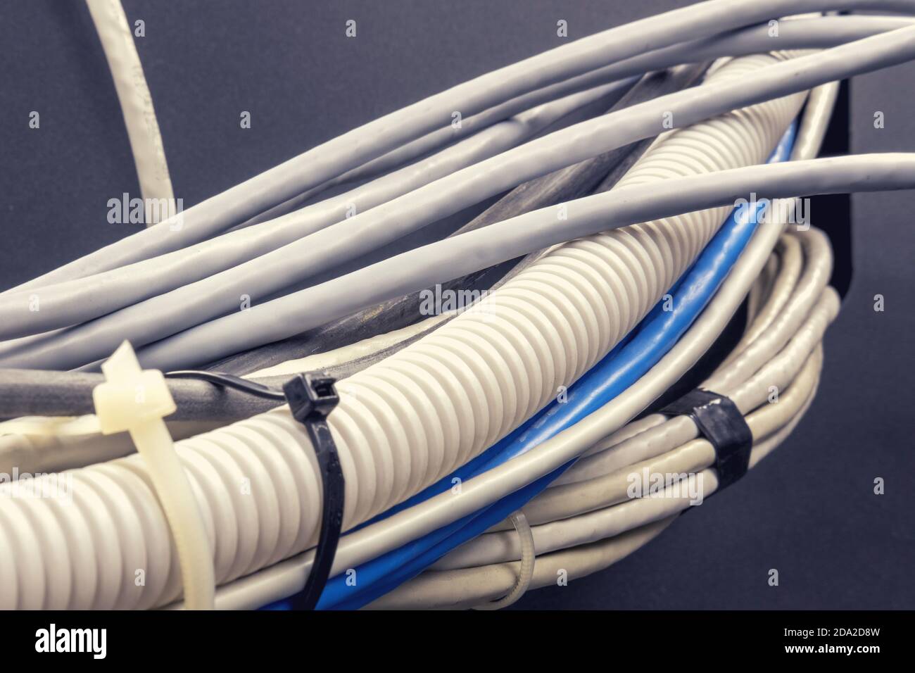 Electrical and network wires are tied with a tie Stock Photo - Alamy