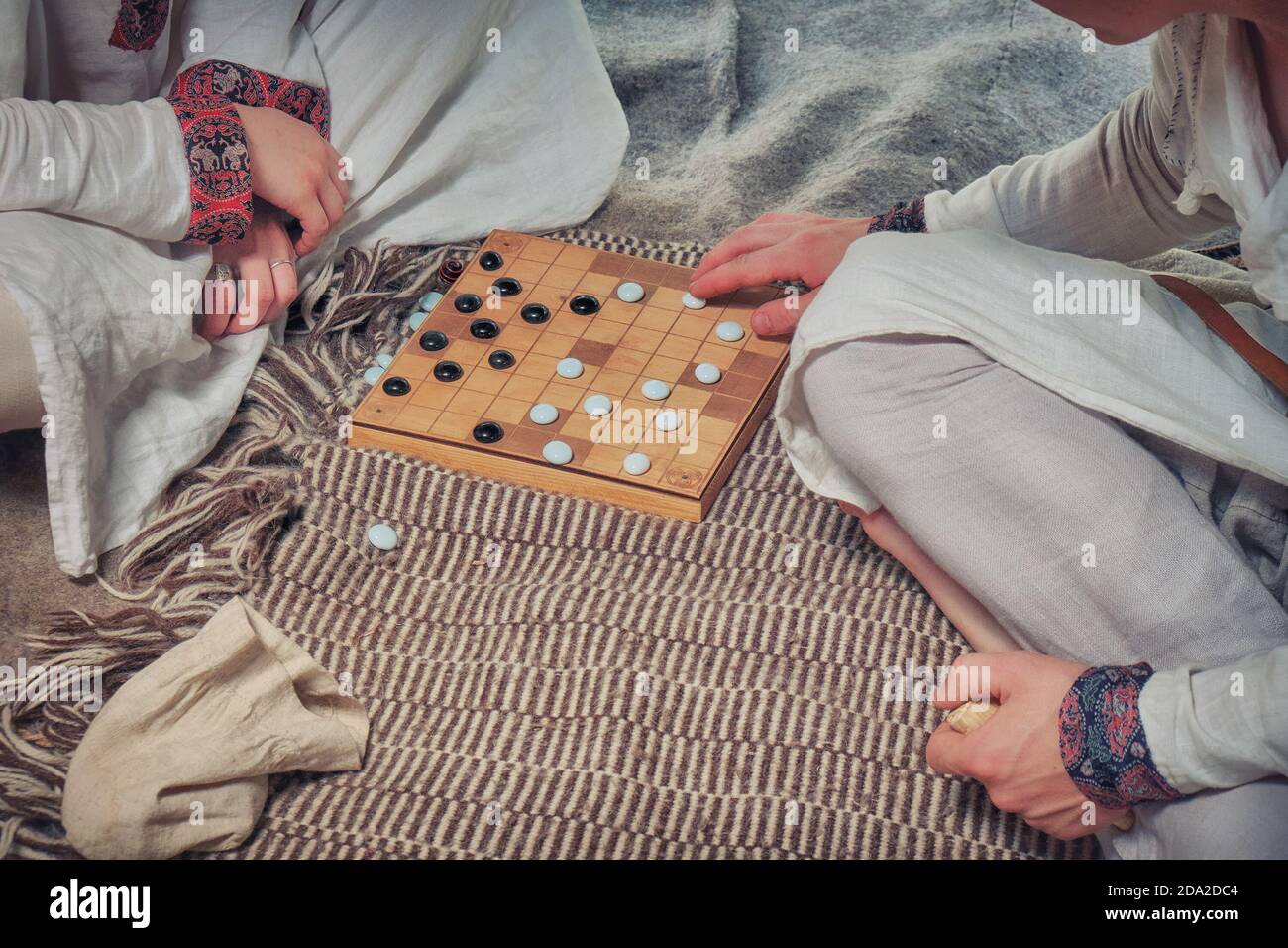 Players at the Board game in vintage style - tafl, hnefatafl. Two ...