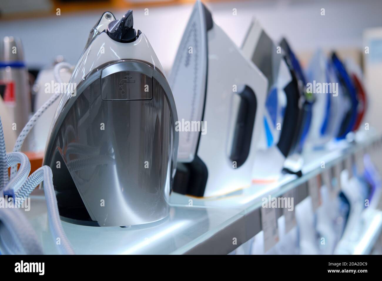 Electric irons from different manufacturers at retail store shelf Stock ...