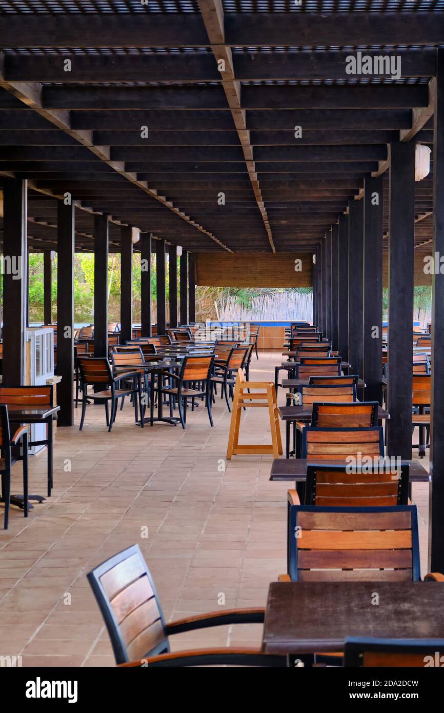 Tables in a restaurant under a canopy near the sea Stock Photo - Alamy