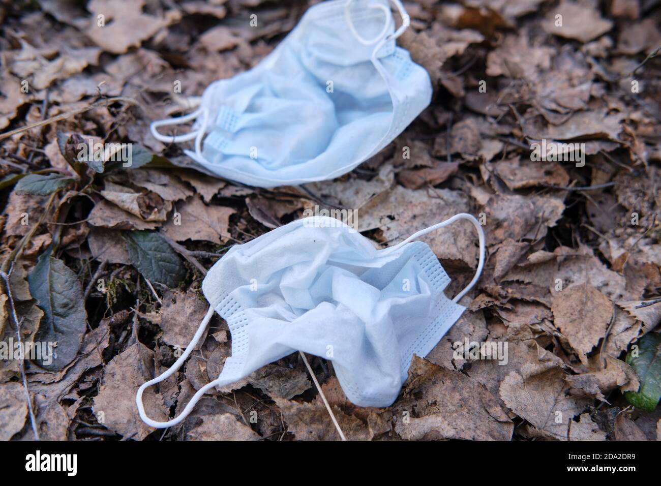 Infected medical masks is lying in the dirt on the ground Stock Photo ...