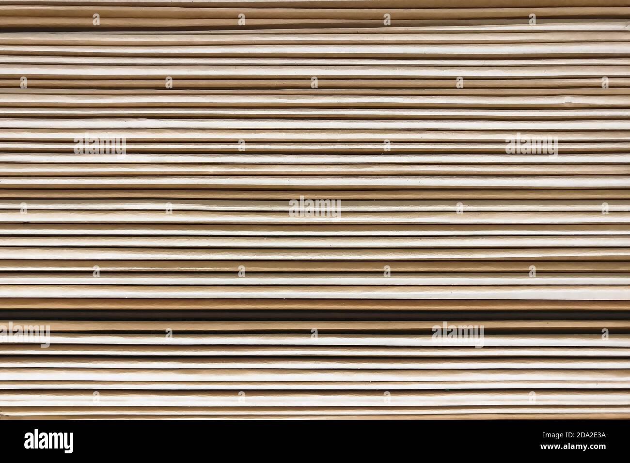 Texture in the form of a stack of cardboard beige Stock Photo - Alamy
