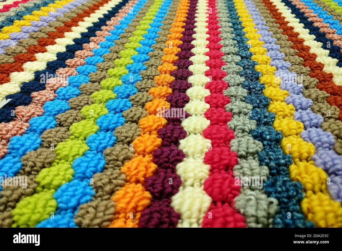 Texture of knitted multicolored wool carpet Stock Photo - Alamy
