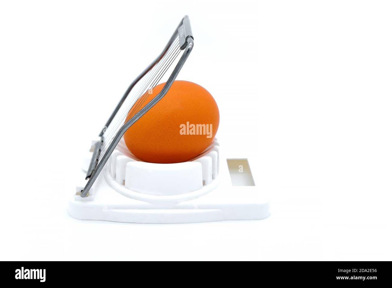 White background, isolate. Cutting eggs for cooking. Egg in shell a ...