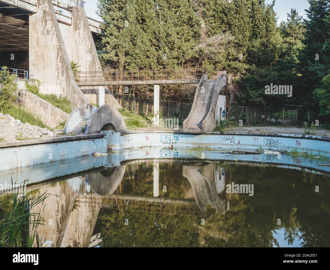 Russia, Sochi 15.06.2020. An old abandoned complex with a muddy swampy ...
